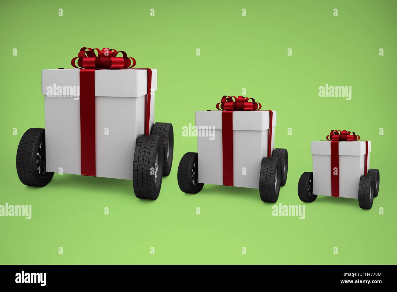 Composite image of gray gift box with wheels Stock Photo - Alamy