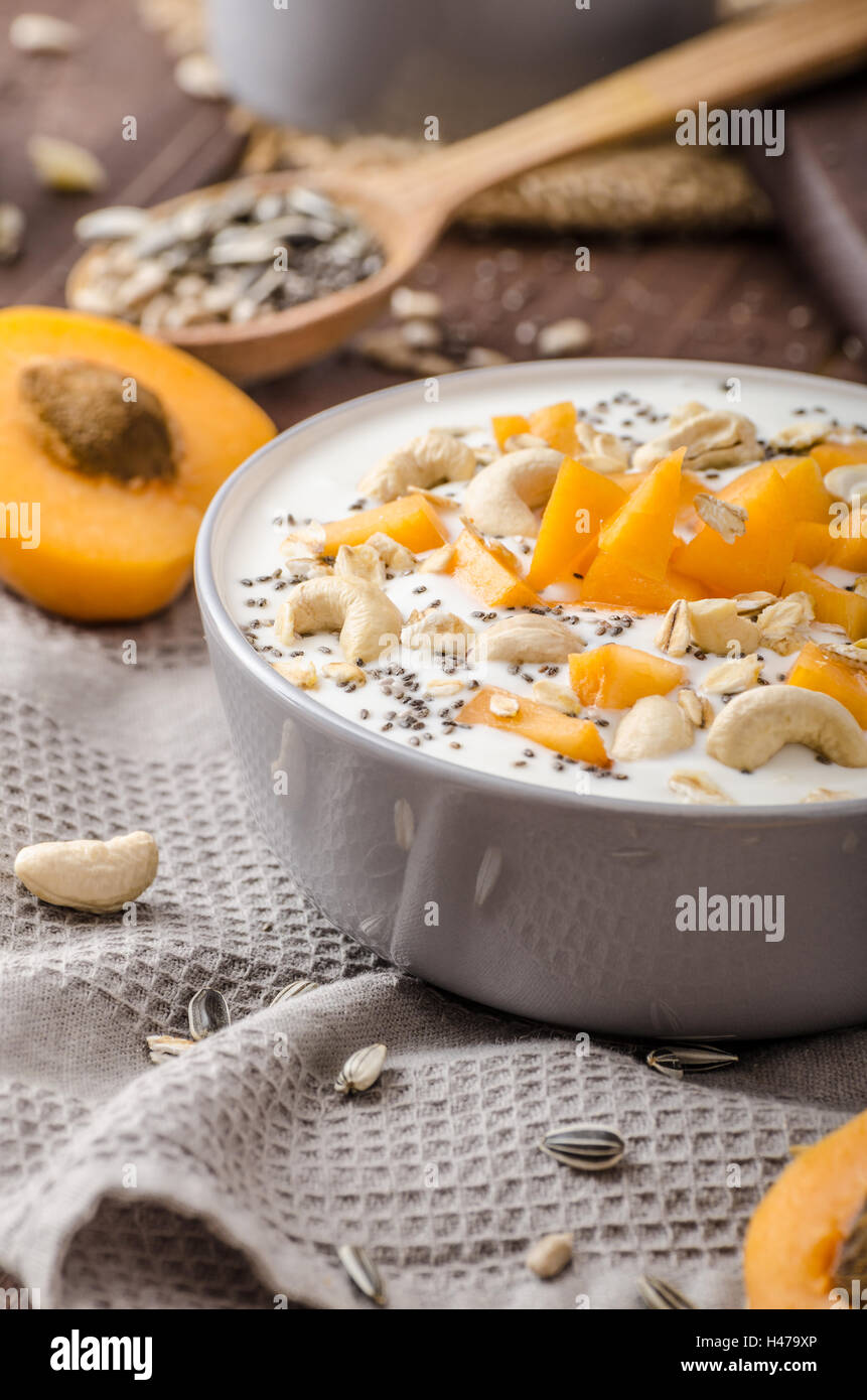 Domestic apricots musli yogurt with milk and crispy nuts and healthy ...