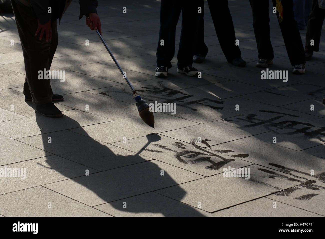 China, Peking, Beihai park, calligraphy, man, brush, water, figure ...