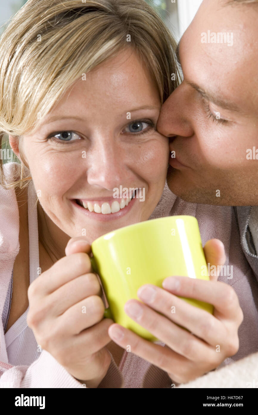 couple, relaxation, at home, drinking tea, kiss Stock Photo - Alamy