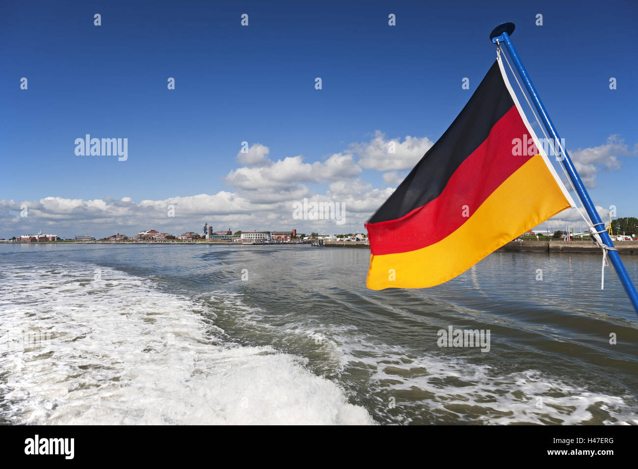 Germany, Wilhelmshaven, Germany flag on holiday ship MS Harle Courier ...
