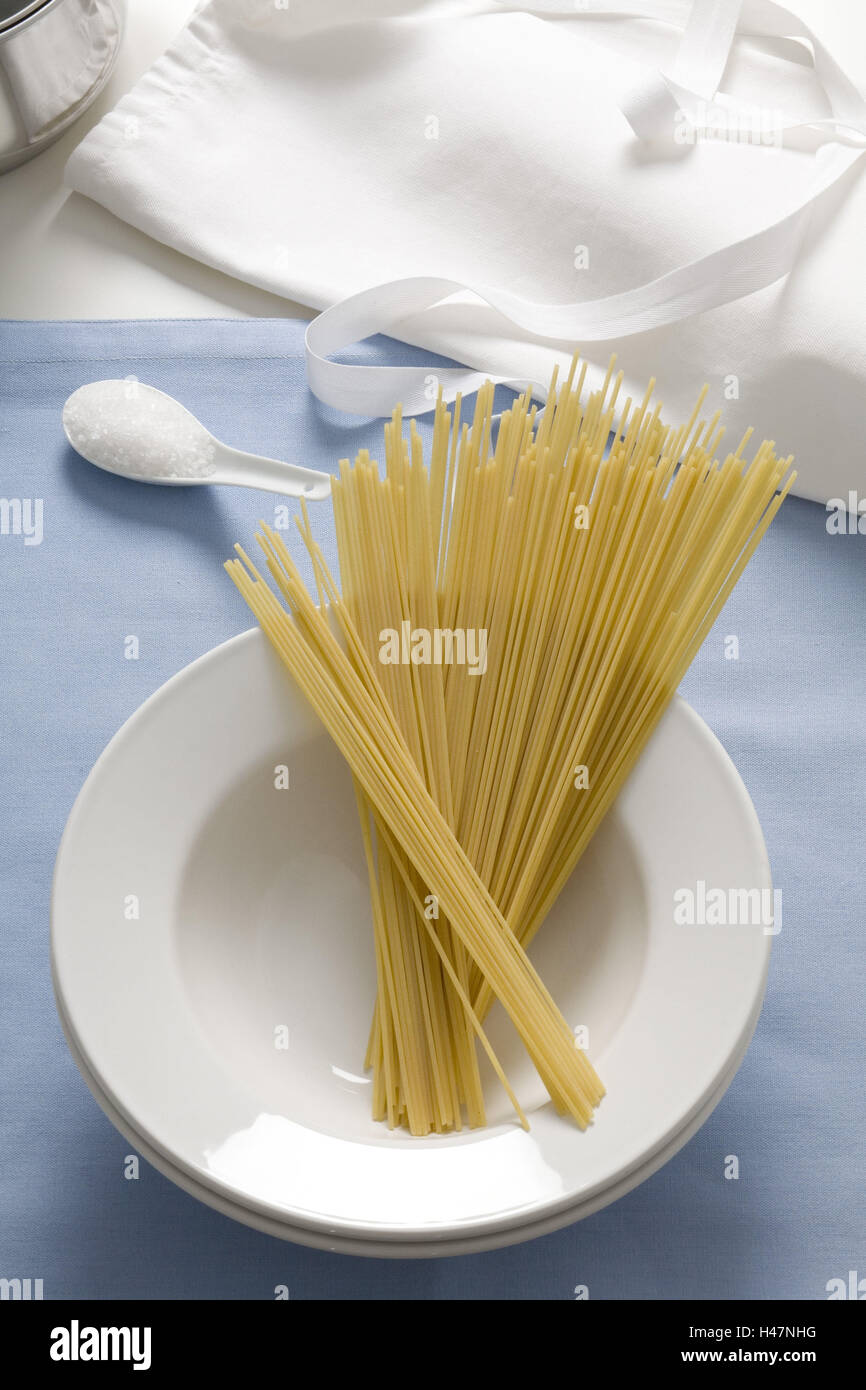 raw spaghetti on white plate Stock Photo - Alamy