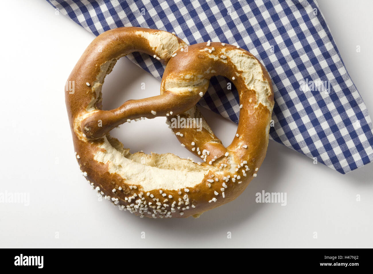 Breze on white-blue napkin Stock Photo - Alamy