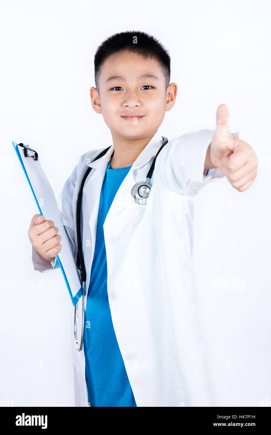 Asian Chinese boy pretending as doctor with thumbs up in isolated plain ...
