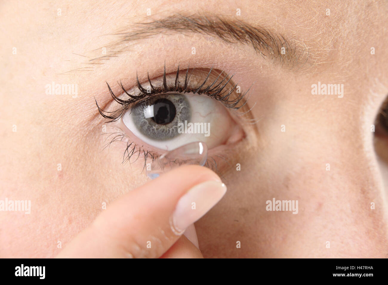 Woman, contact lens, close-up, put in Stock Photo - Alamy