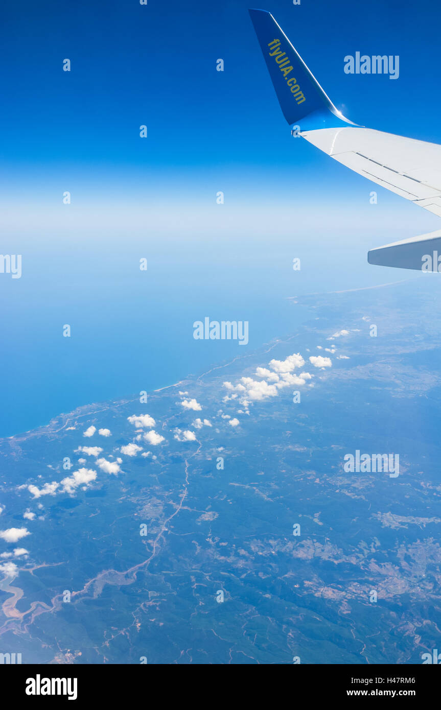 The plane of Ukrainian International Airlines is flying over the ...