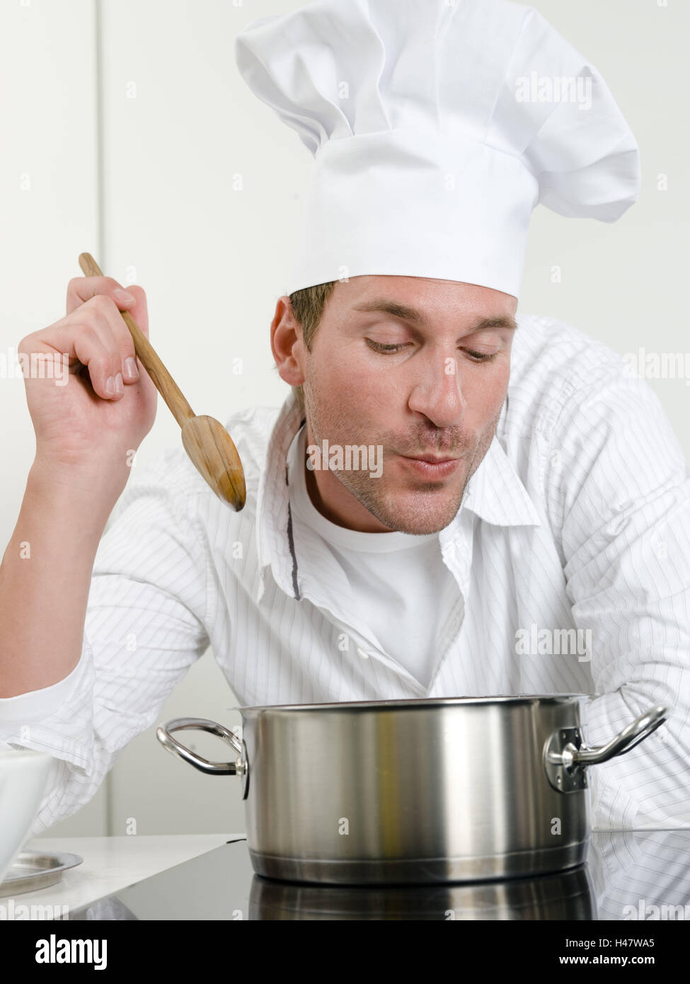 Man with spoon in mouth hi-res stock photography and images - Alamy