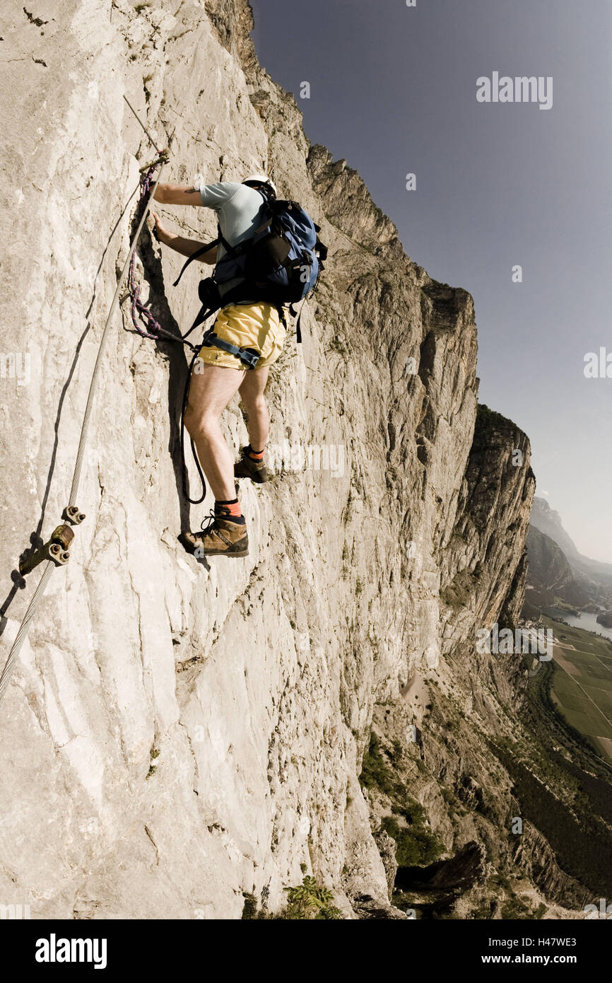 Mountaineers, cliff face, climbing steep path, climb, hold on rock ...