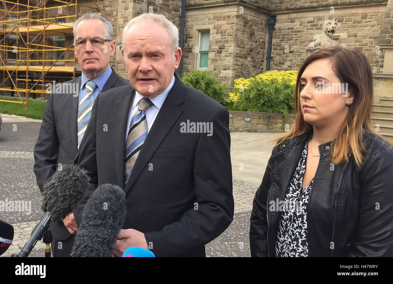 Martin McGuinness (centre) speaking outside Stormont Castle near ...