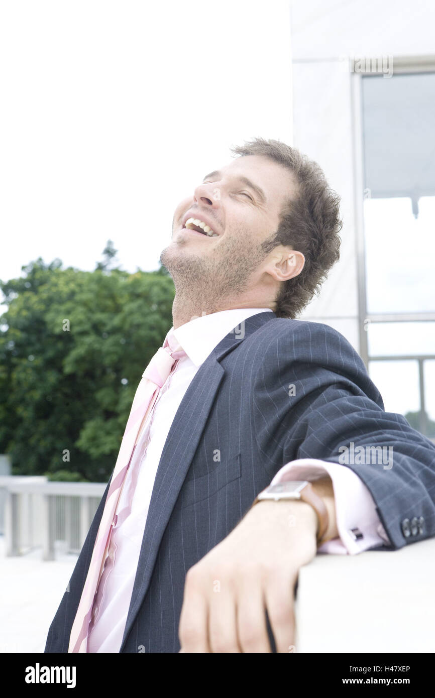 Man, young, lean, laugh, half portrait, building, office building ...