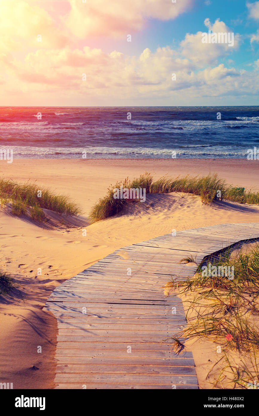 Marine landscape at sunset, wooden pathway to the sea Stock Photo - Alamy