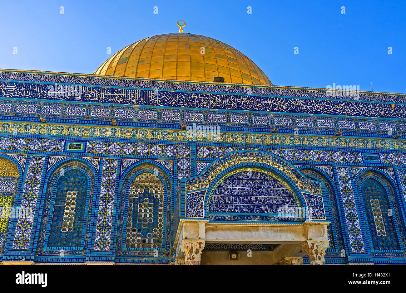 The glazed tiles of the Dome of the Rock are mostly in shades of blue ...