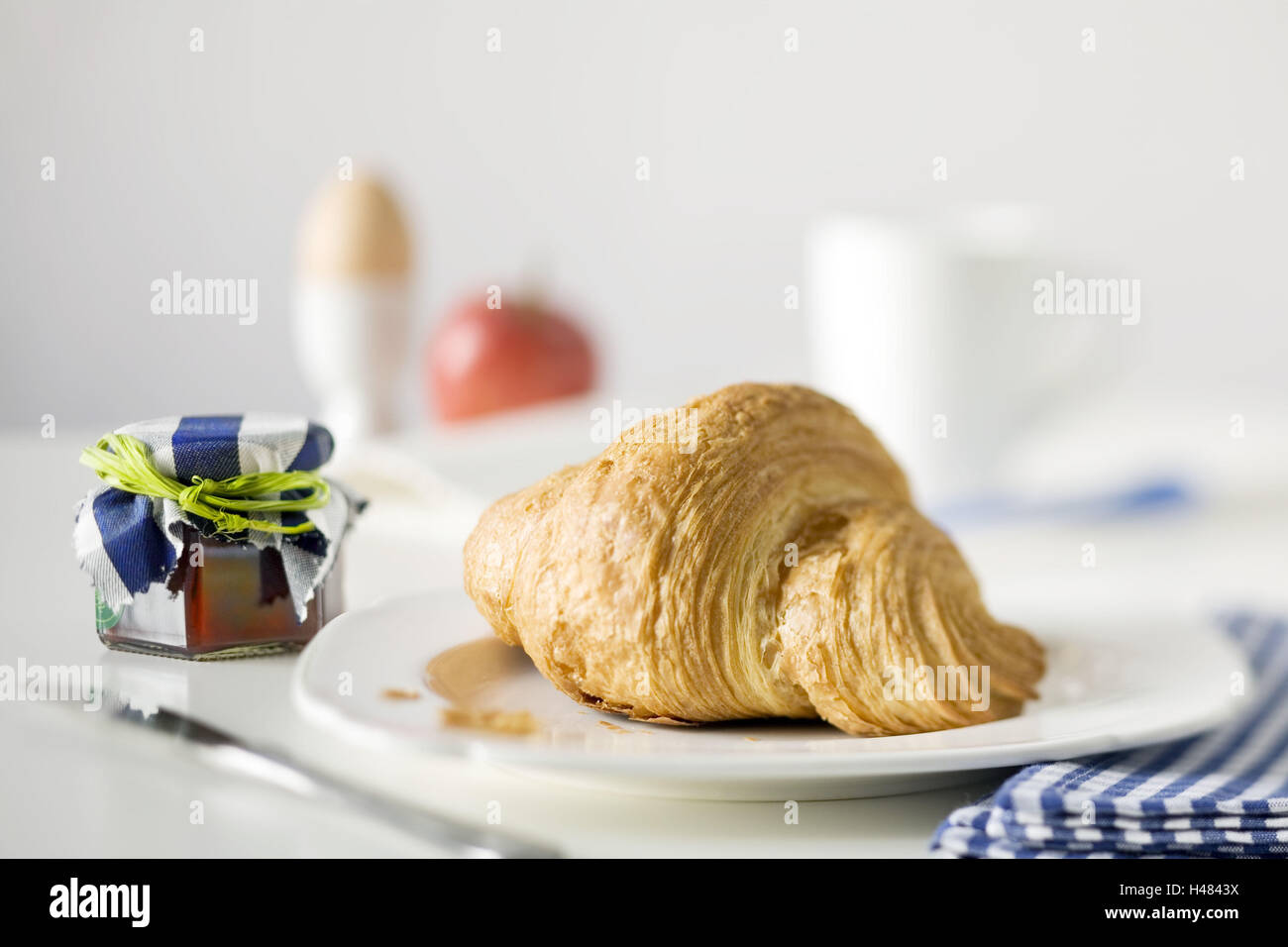 Croissant on breakfast table Stock Photo - Alamy