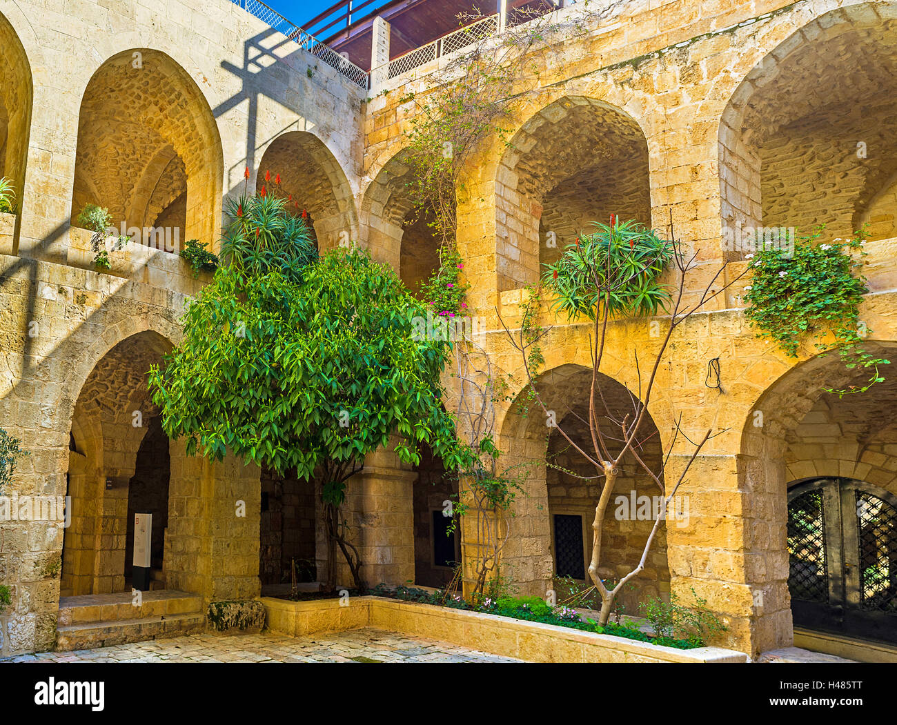 The stone courtyard of Lutheran Kirche of the Redeemer with the arched ...