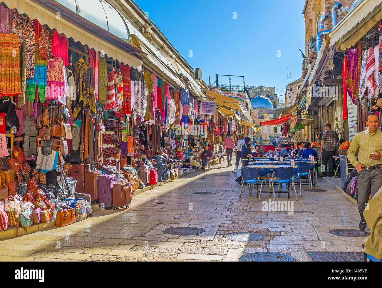 The colorful Aftimos Bazaar with numerous tourist stalls, outdoor ...