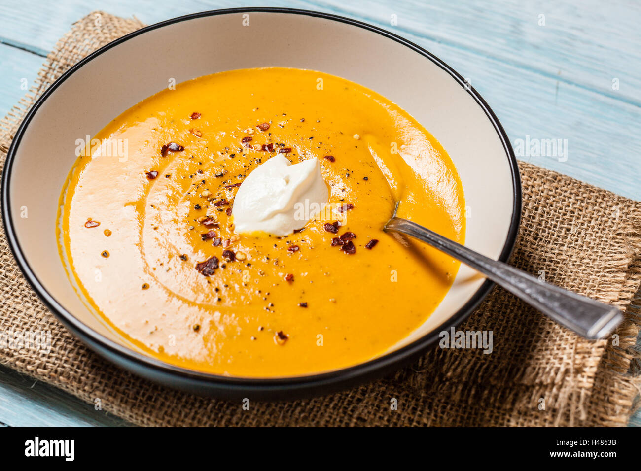 Bowl of homemade healthy butternut squash soup, served with chilli ...