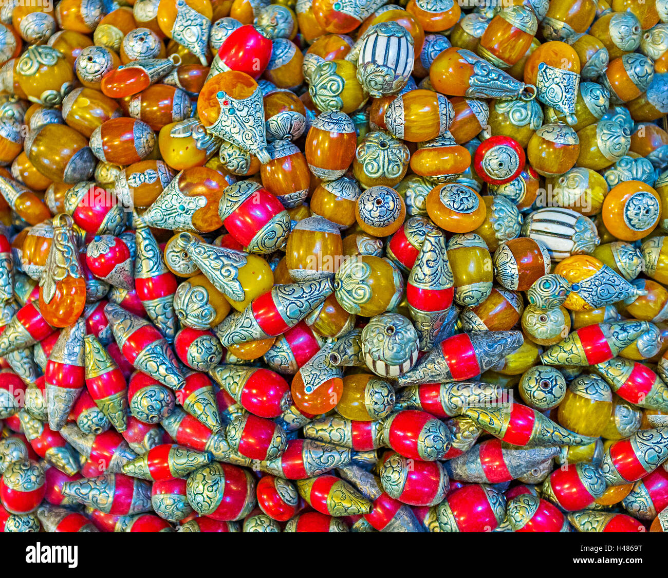 The amber and corall beads, decorated with patterns of silver ...