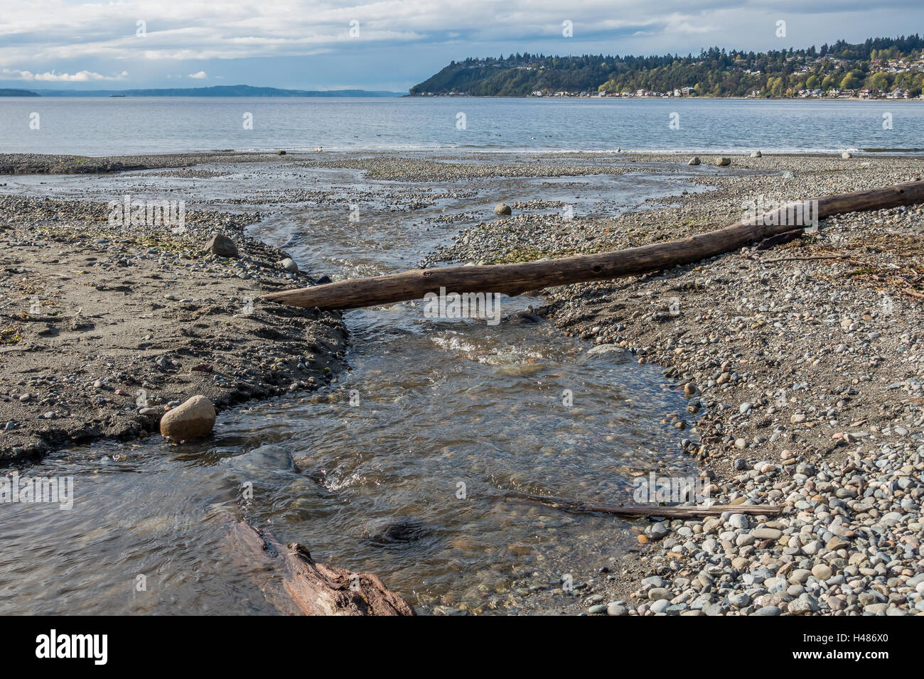 Water flows into the Puget Sound at Seahurst Park in Burien, Washington ...