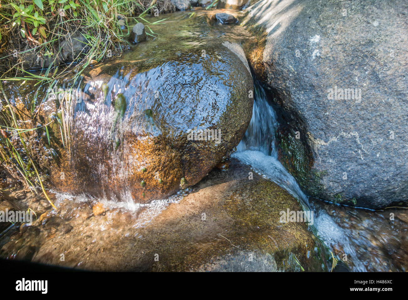 Water flows between rock at Coulon Park in Renton, Washington Stock ...