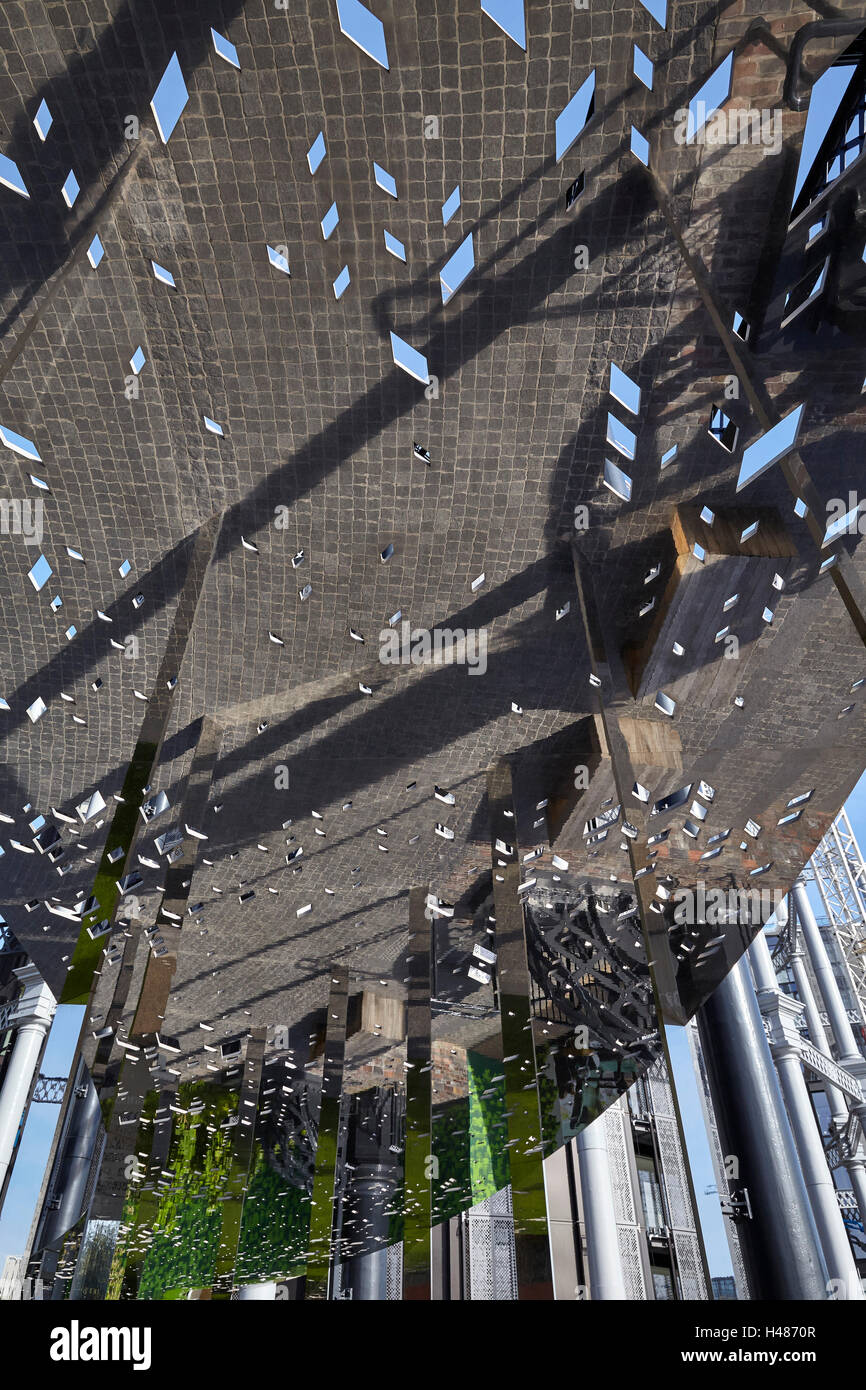 Looking up at the mirrored ceiling with abstract apertures. Gasholder ...