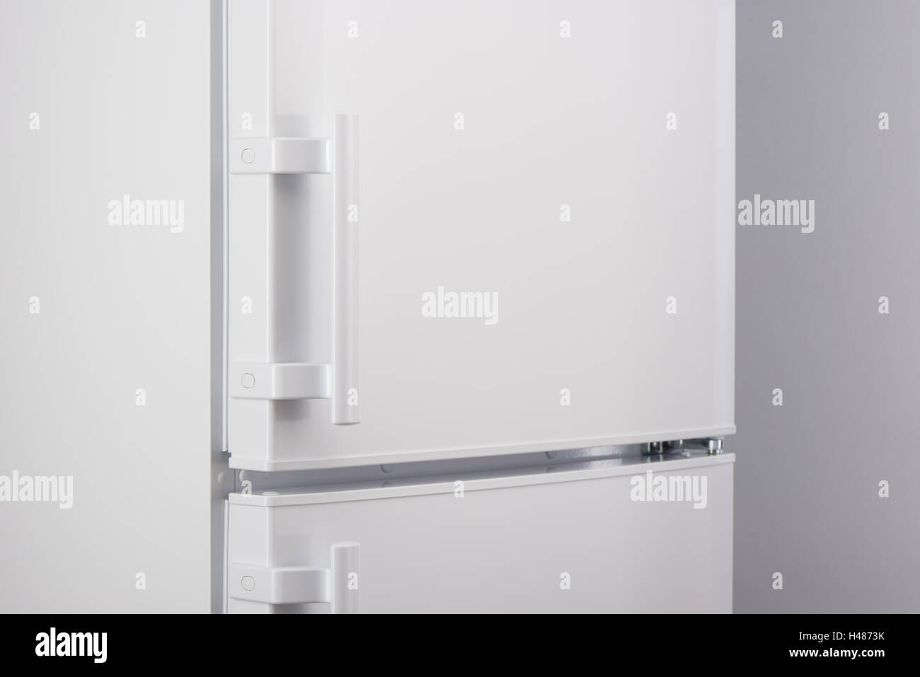 Close up of white refrigerator on gray background Stock Photo - Alamy