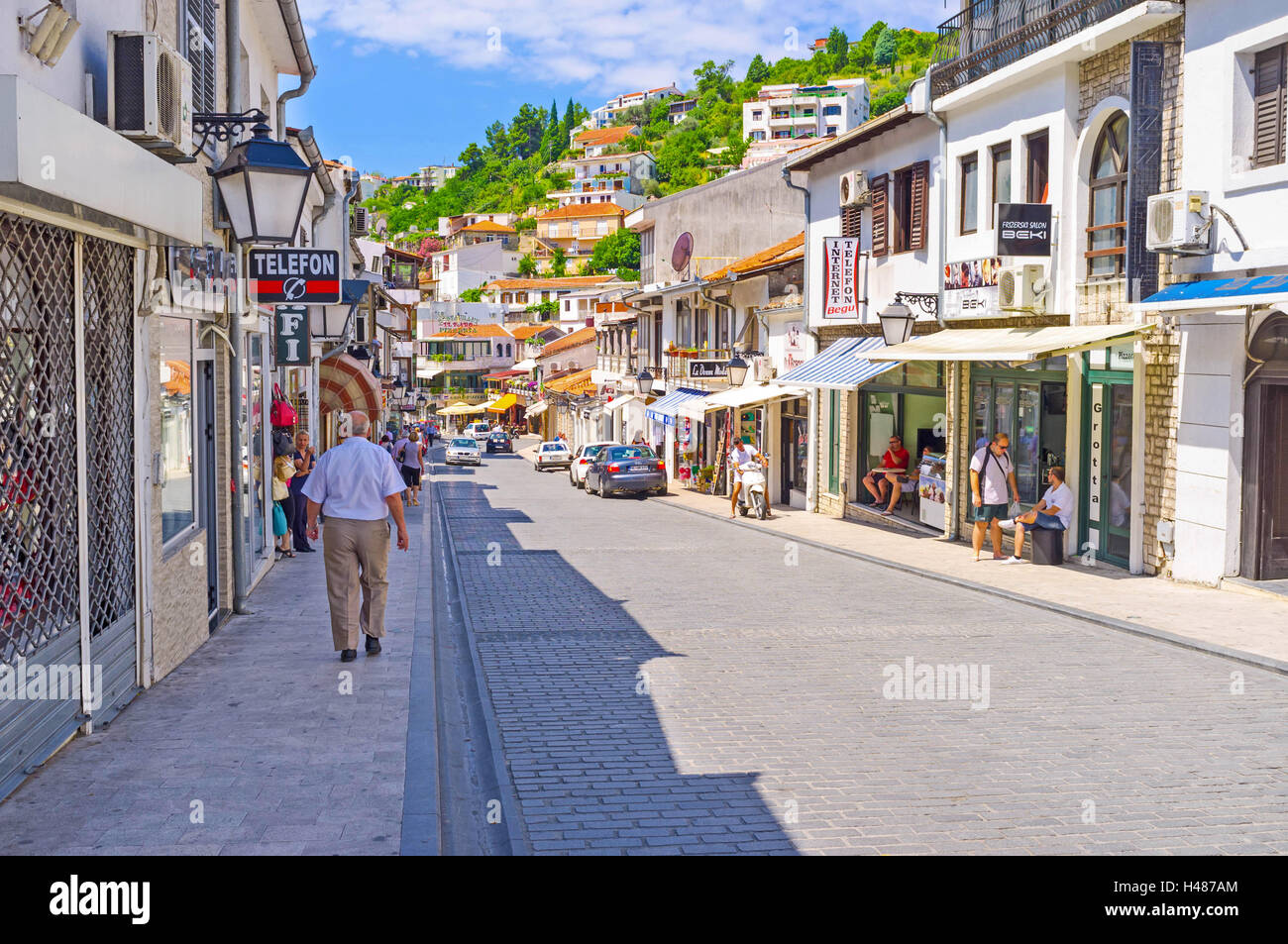 The shopping street with many cafes and bars leads to the beach, Ulcinj ...