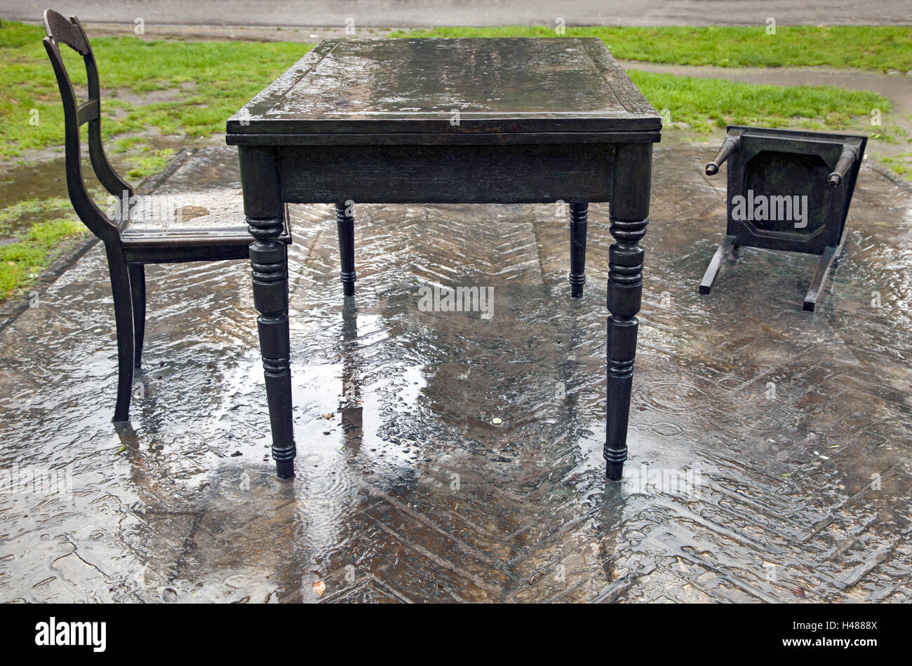 Table, chair, fallen down Stock Photo - Alamy