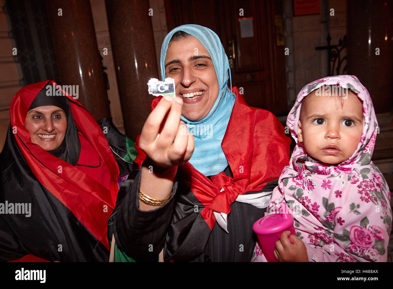 A group of Libyans celebrate outside the Libyan Embassy in London after ...