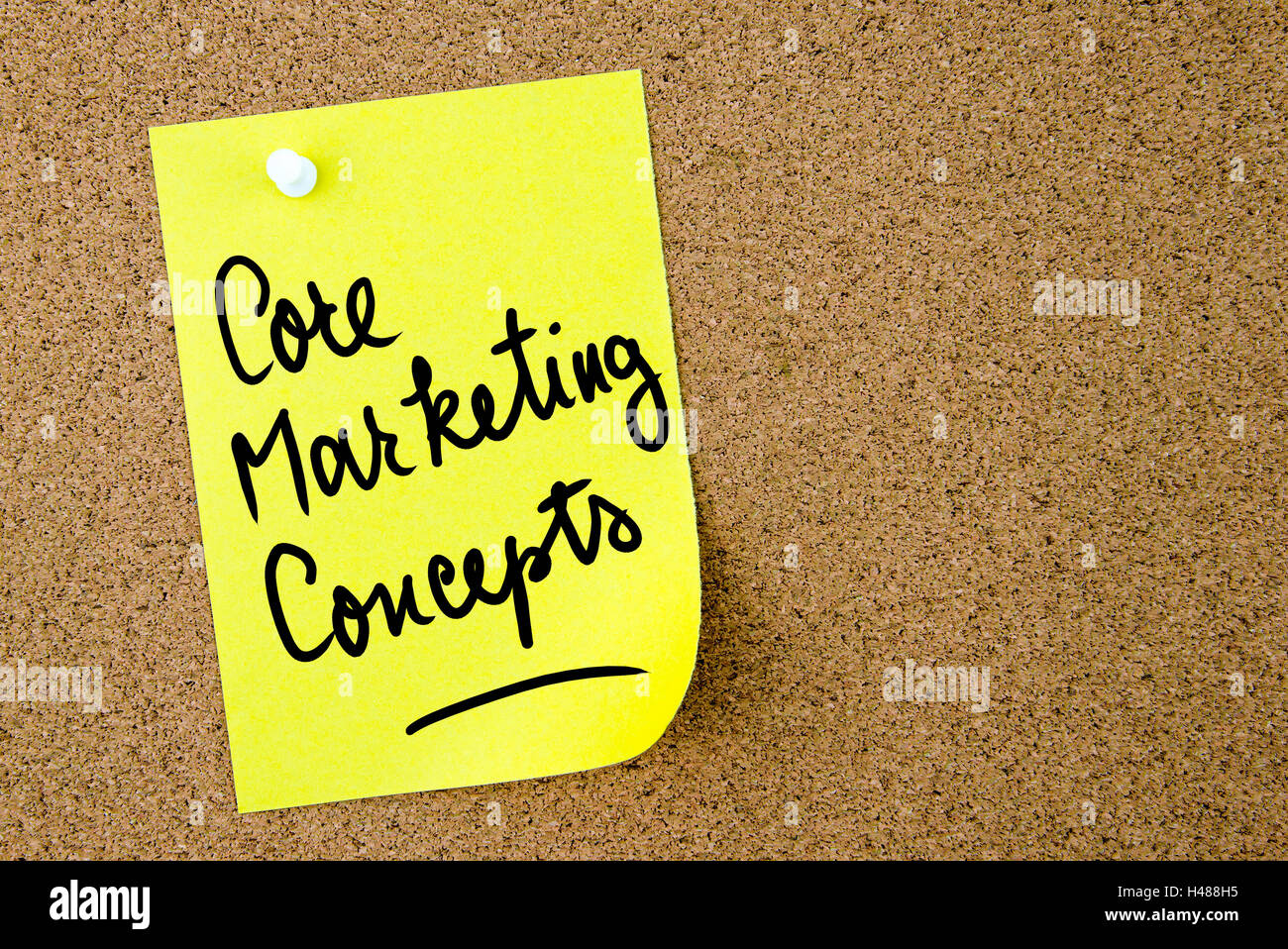 Core Marketing Concepts text written on yellow paper note pinned on ...