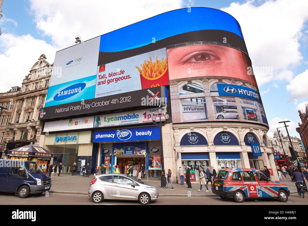 An LED advertising sign at Piccadilly Circus displays interpretations ...