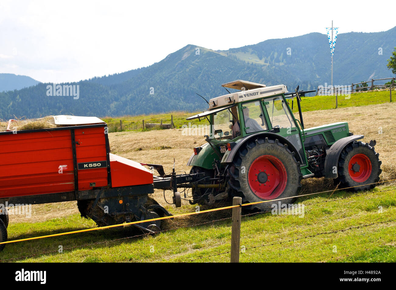 Tractor with trailer, hay harvest, Tegernsee valley, Bavaria, Germany ...