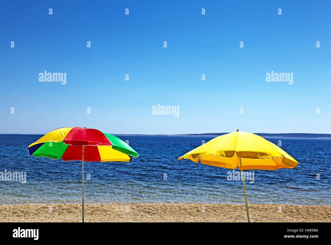 coloured sunshades on the beach Stock Photo - Alamy