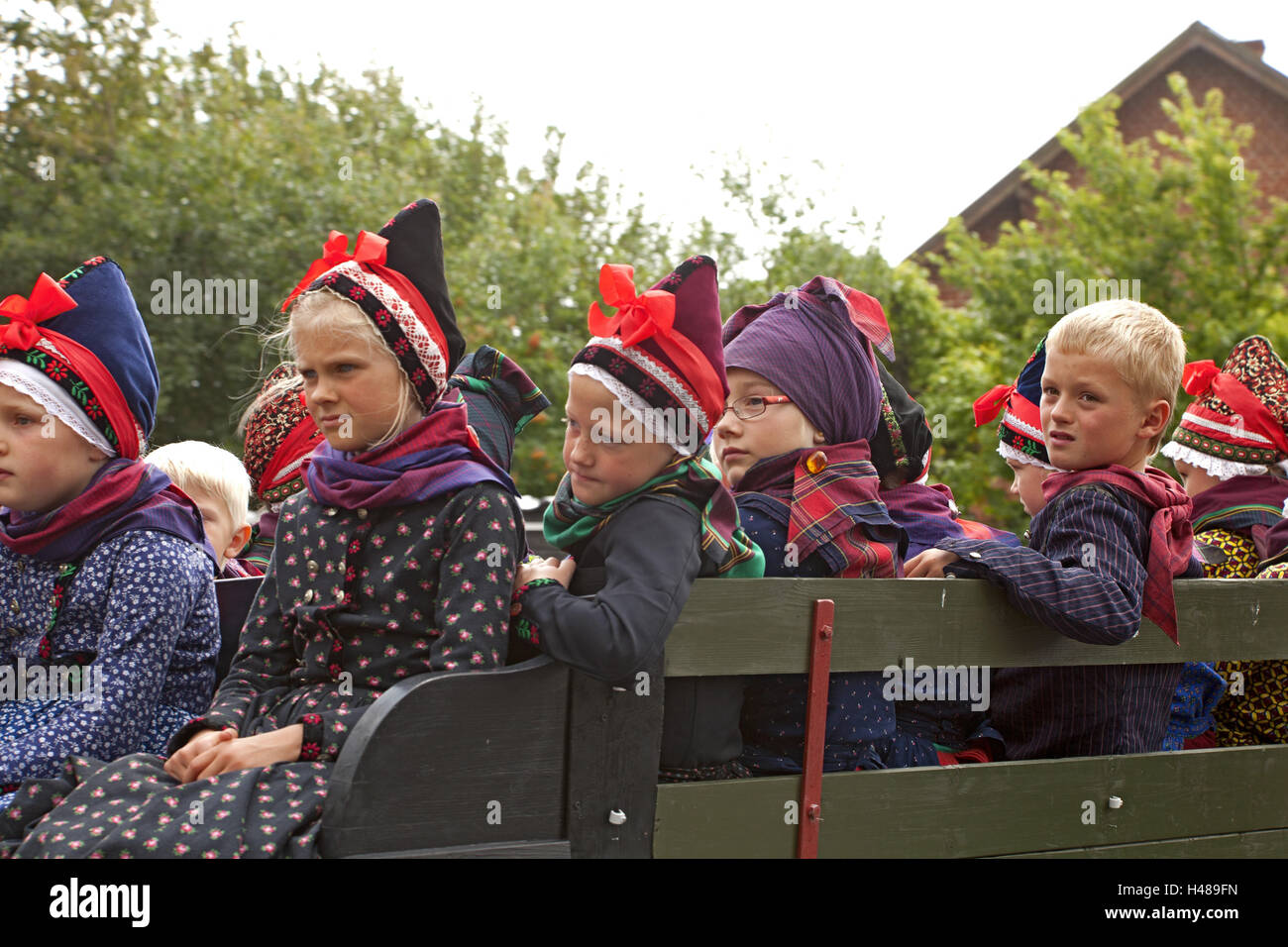 Carriage, children, traditional costumes, procession, public festival ...