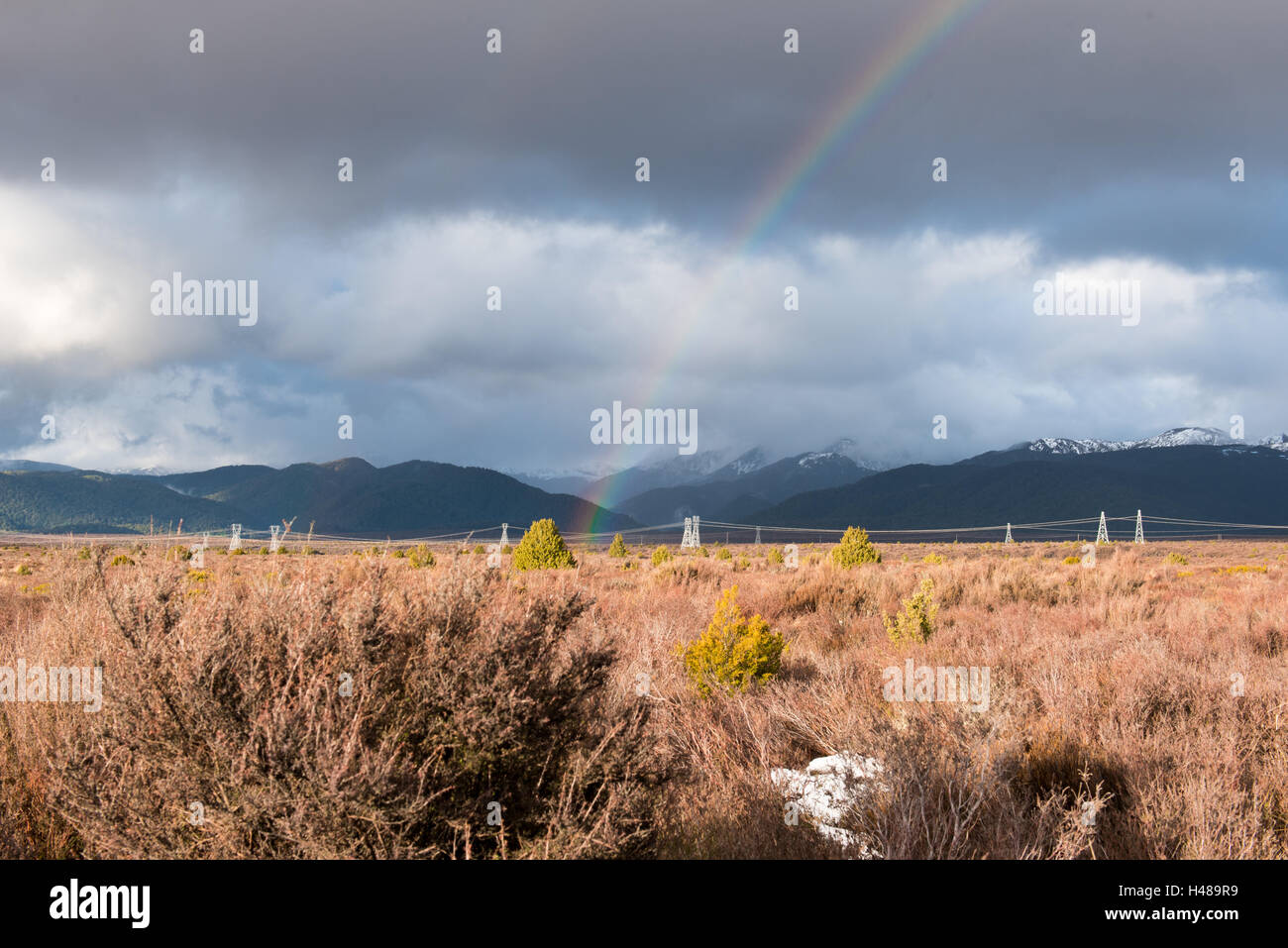 Rainbow against snow capped mountain Stock Photo - Alamy