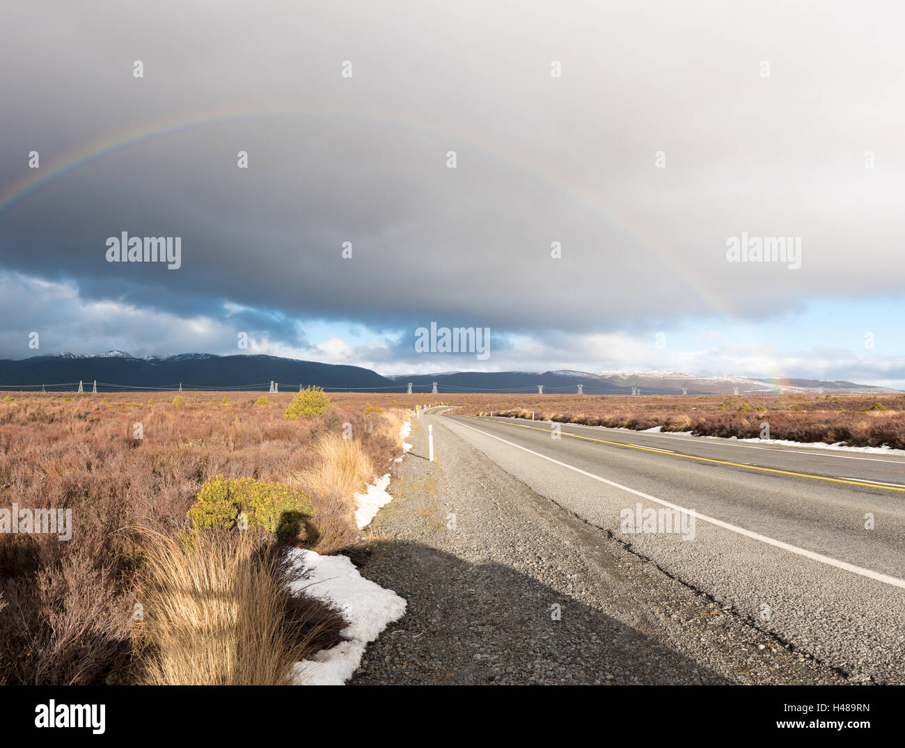 Rainbow against snow capped mountain Stock Photo - Alamy