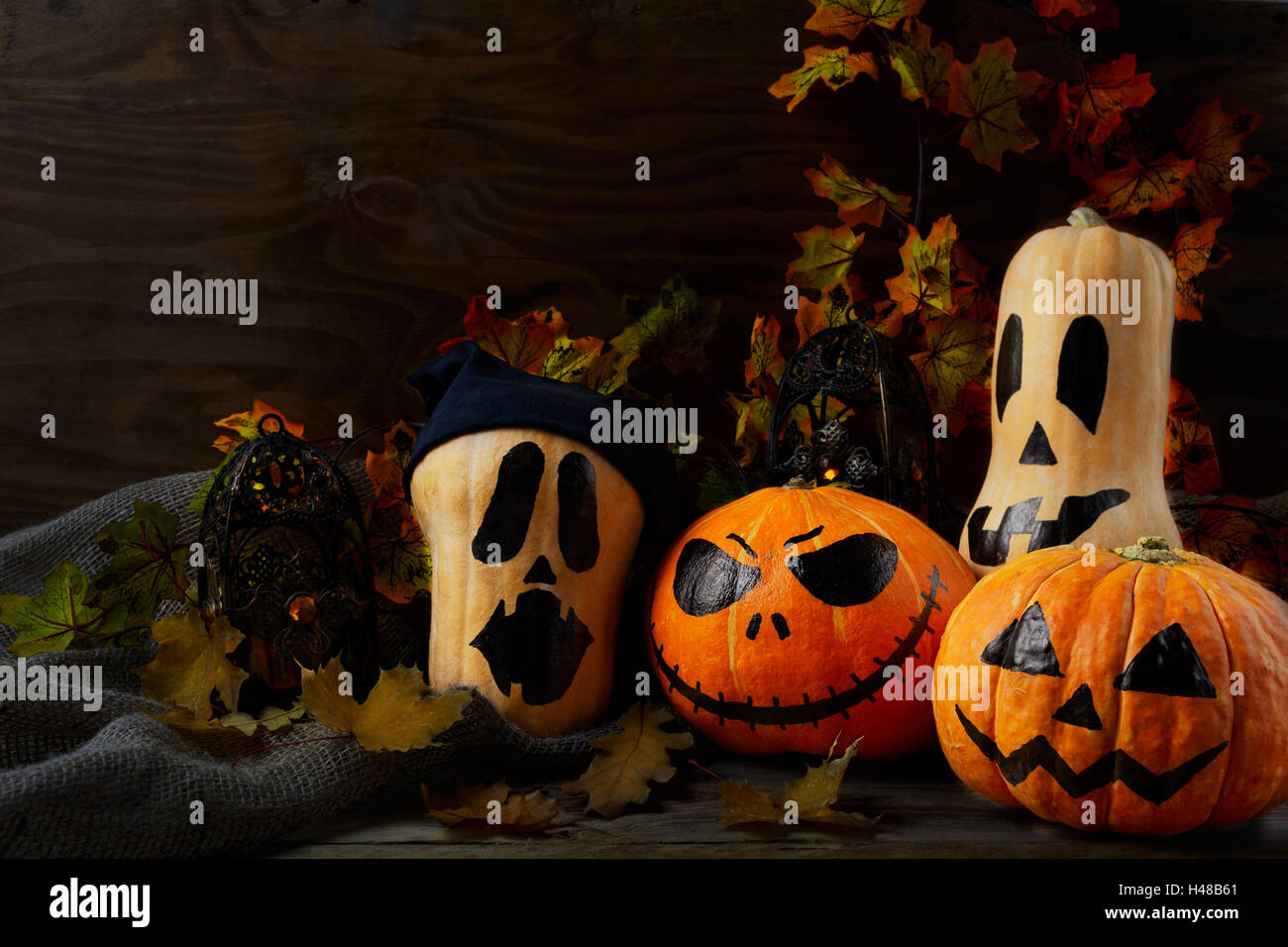 Halloween decorated pumpkins on dark rustic background, copy space ...