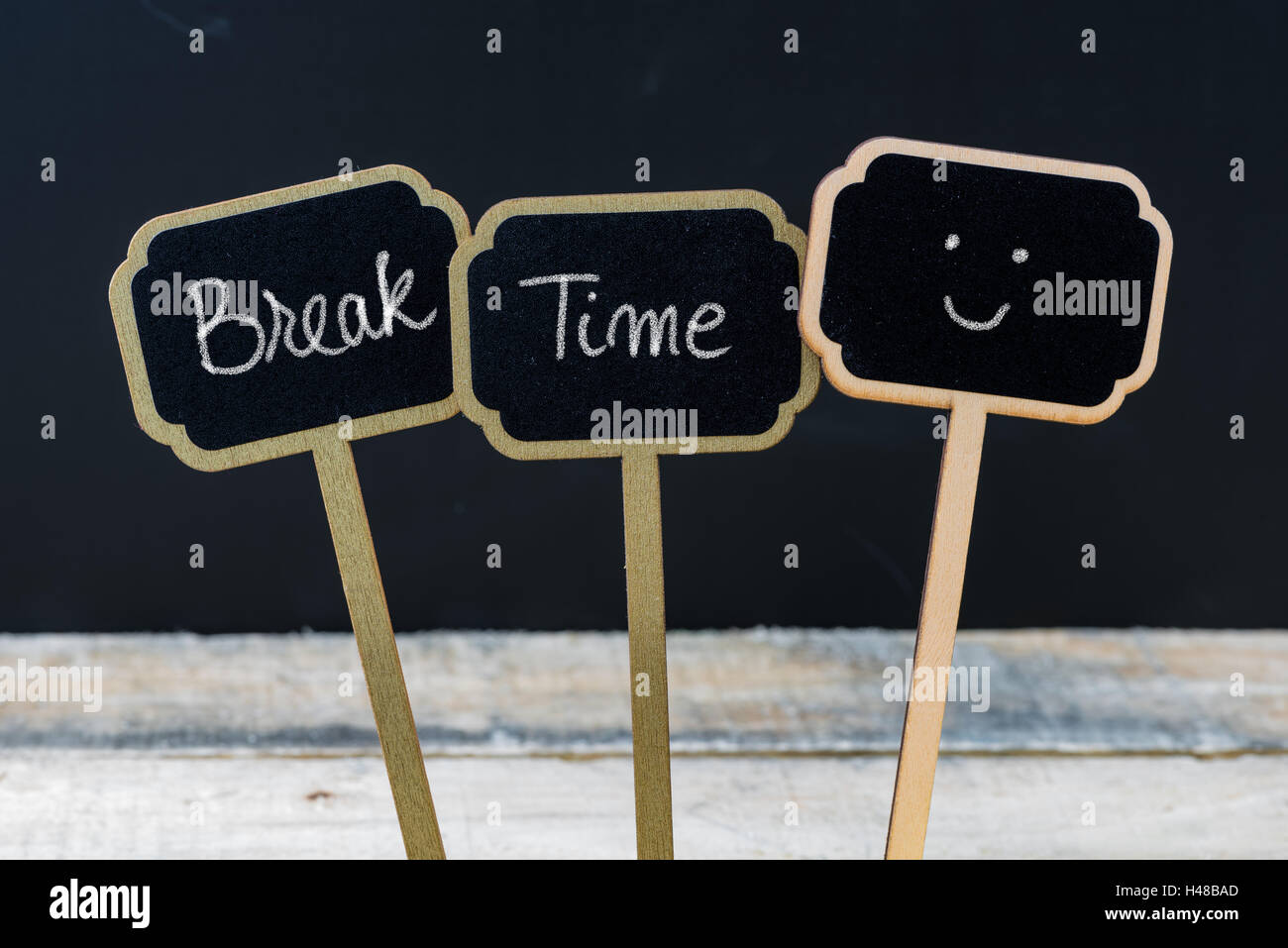 Motivational message Break Time written with chalk on wooden mini ...