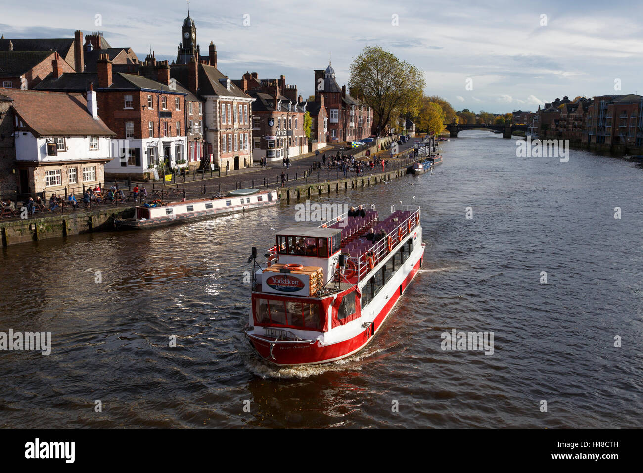 A ‘YorkBoat’ river cruise setting off on the River Ouse at Ouse Bridge ...