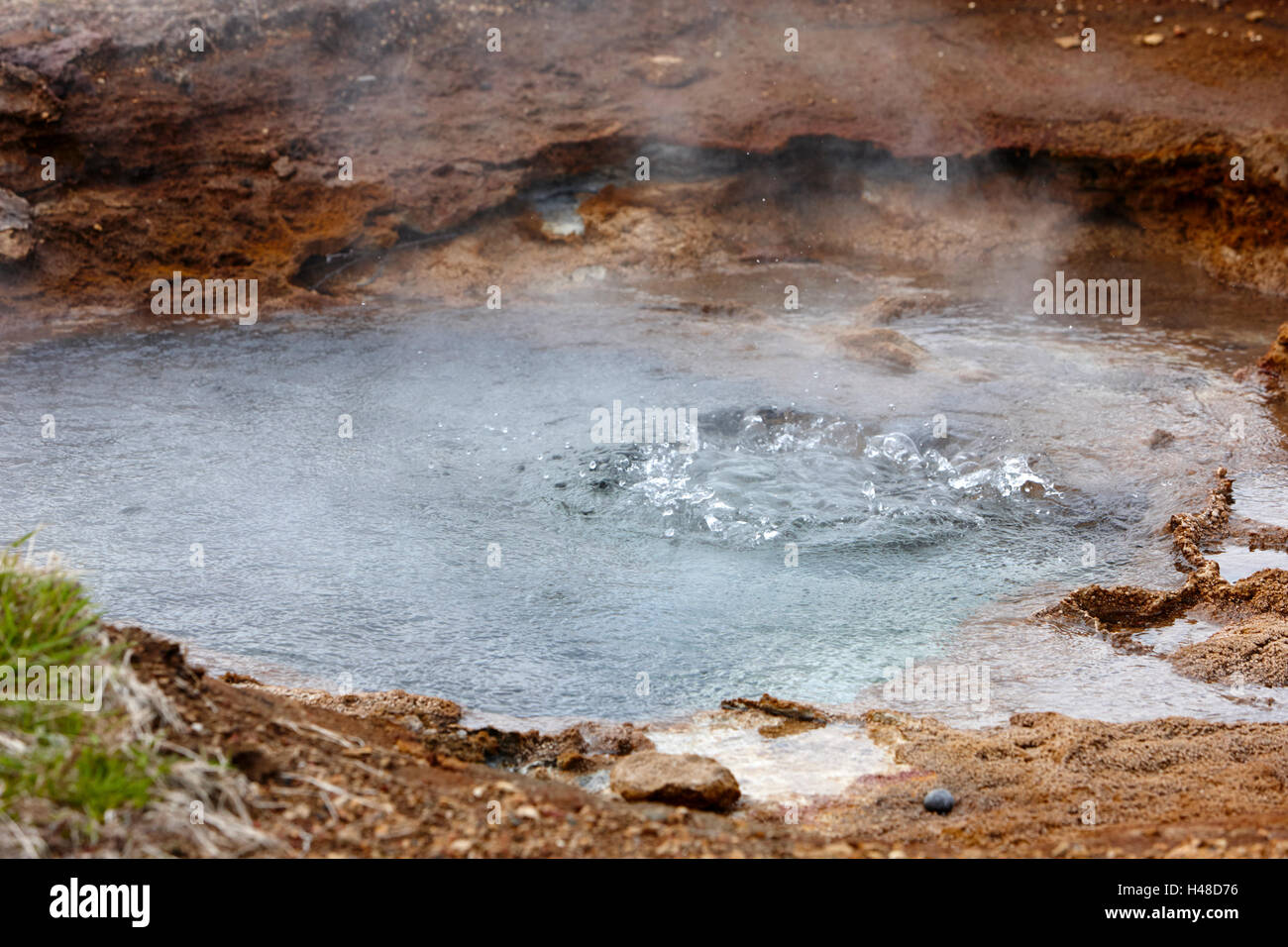 hot water bubbling with chemical and geological deposits caused by ...