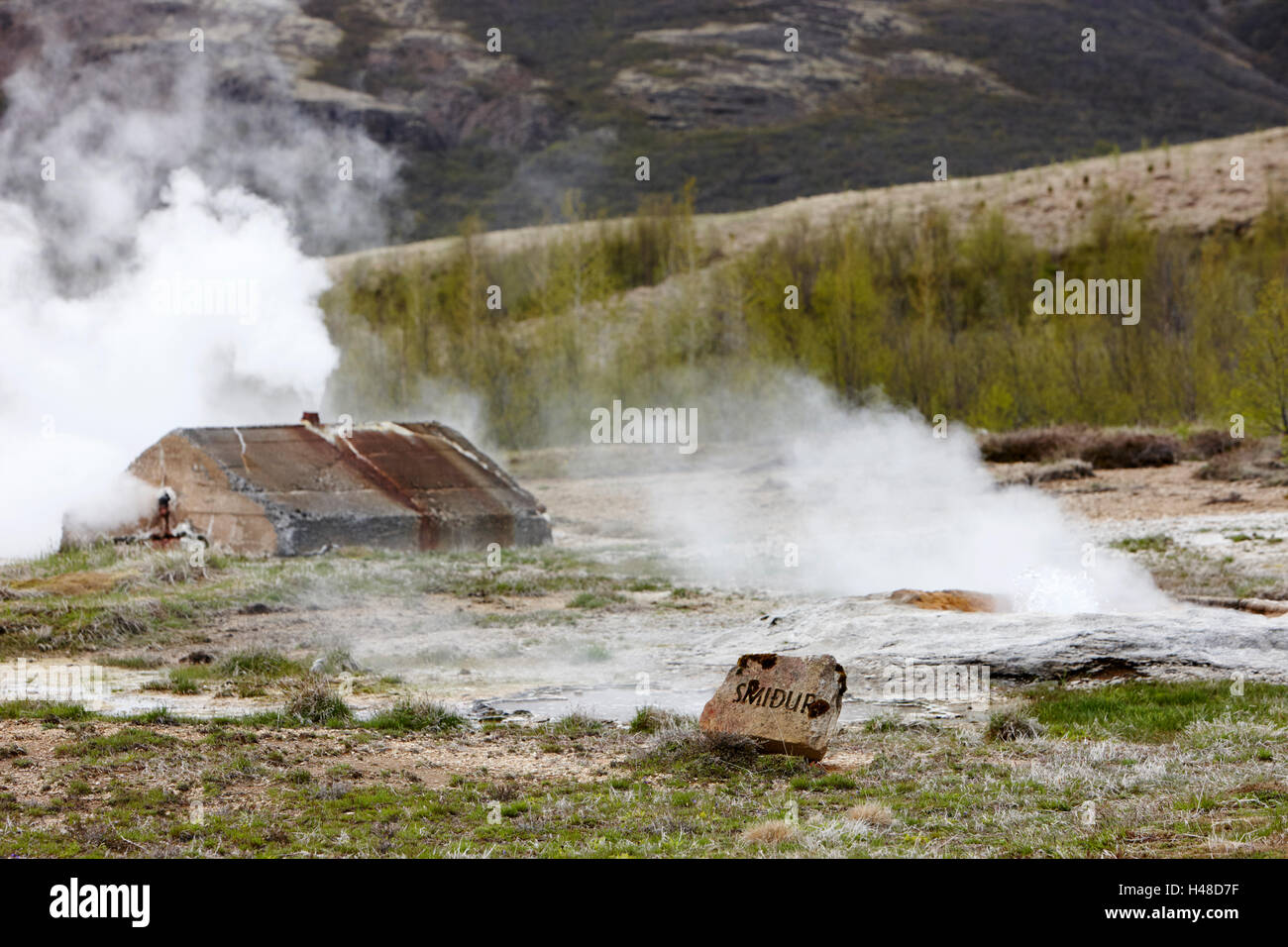 steam rising from geothermal hotspots and small smidur geysers at ...