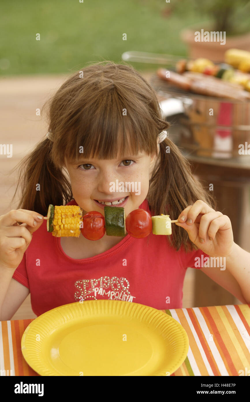 Child, girl, vegetable spit, hold, view camera, smile, outside Stock ...