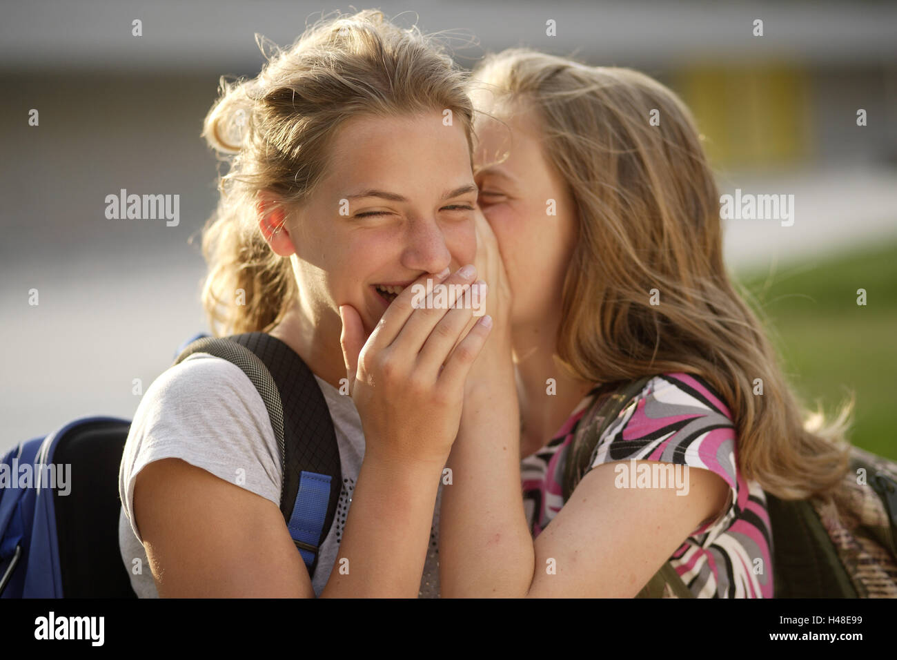 Children, girls, whisper, fun, joy, gesture, portrait Stock Photo - Alamy