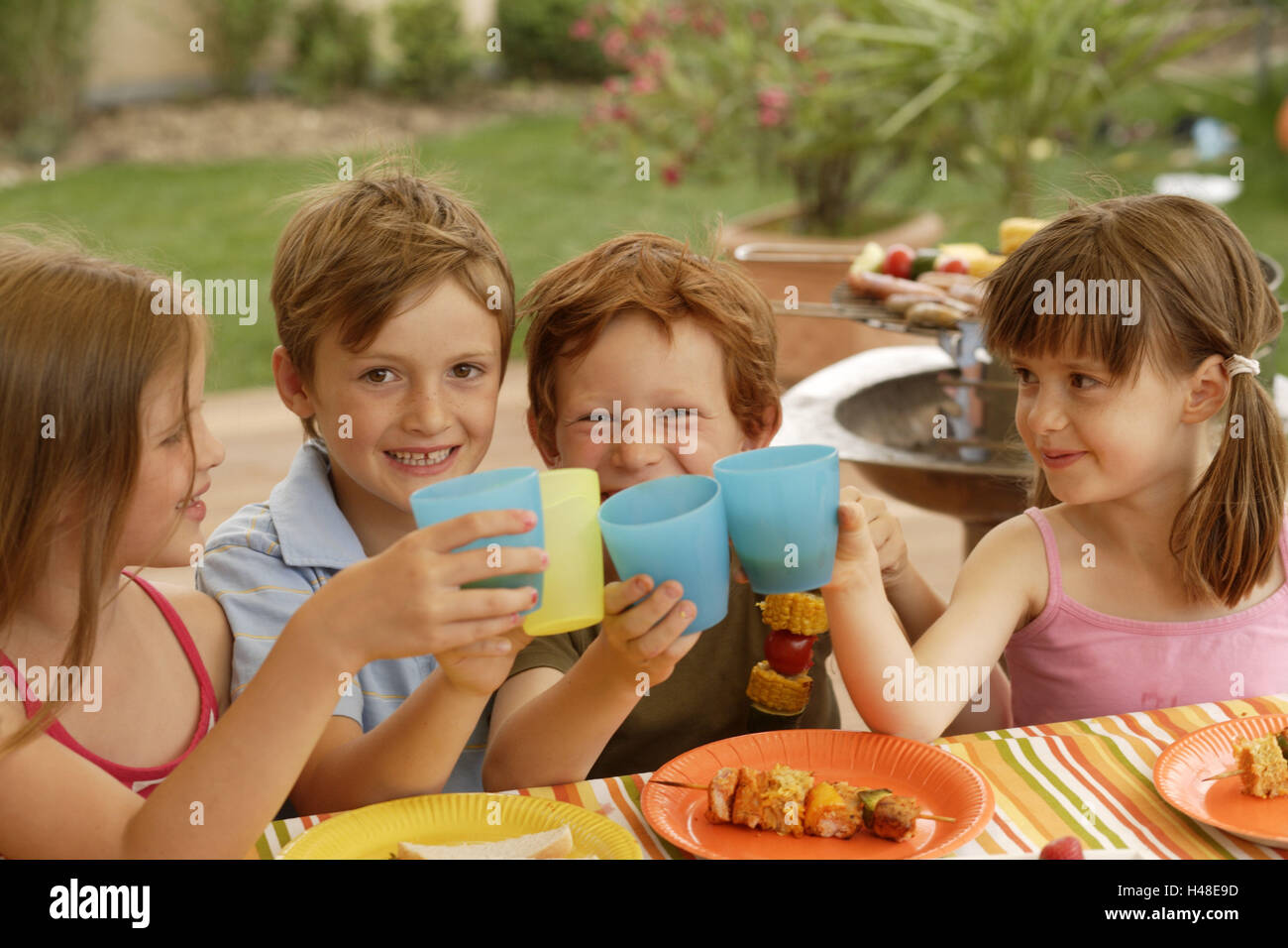 Children, garden party, cup, toasting, drinking, fun, outside Stock ...