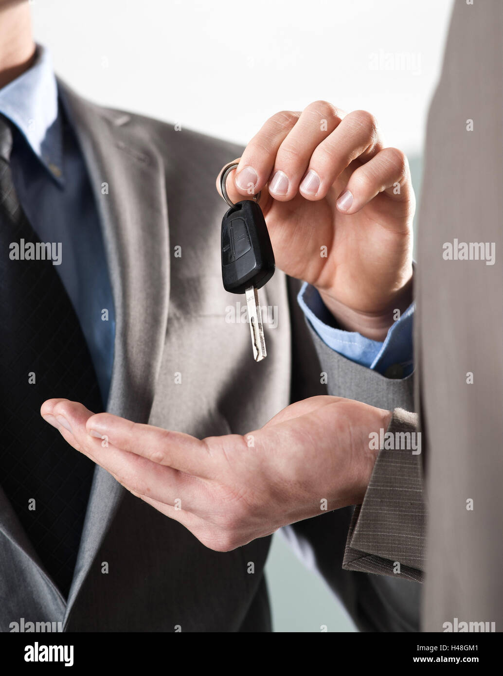 A man places to another man key in the hand, close-up, detail Stock ...