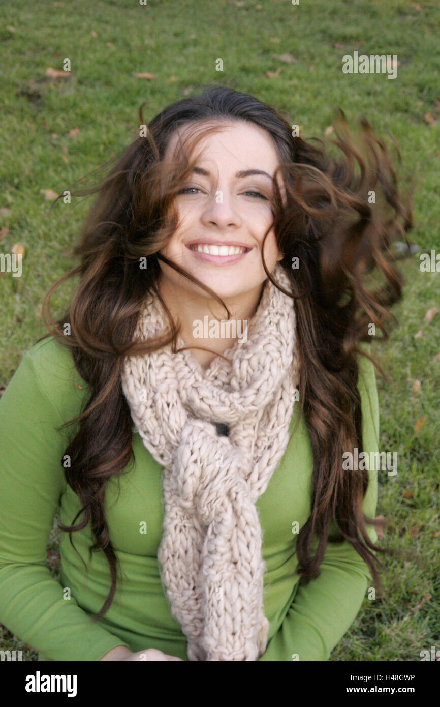 Woman, smiling, throwing hair up Stock Photo - Alamy