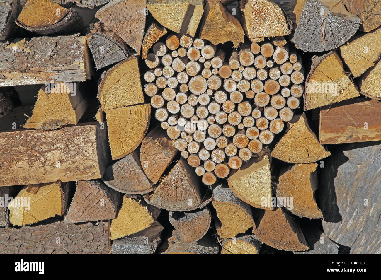 Heart shape in wood pile hi-res stock photography and images - Alamy