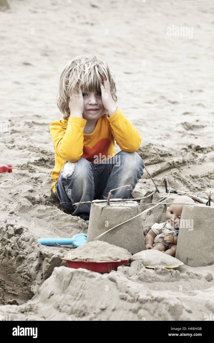 Girls, play, sand castle, doll Stock Photo - Alamy