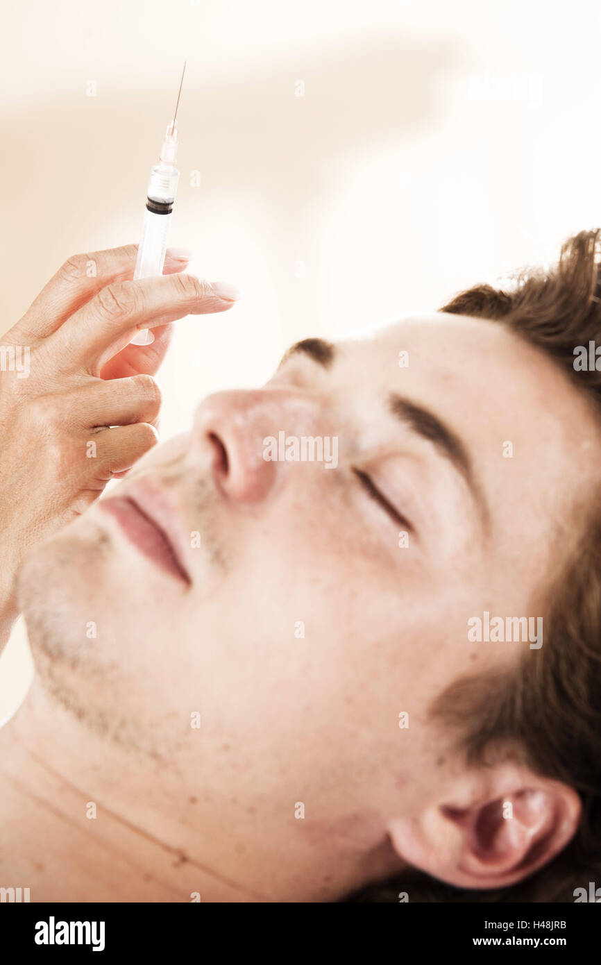 young man getting an injection Stock Photo - Alamy