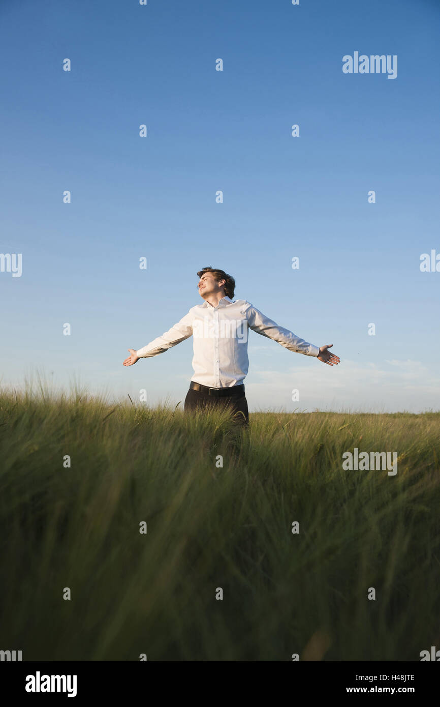 Young man stands in grain field hi-res stock photography and images - Alamy
