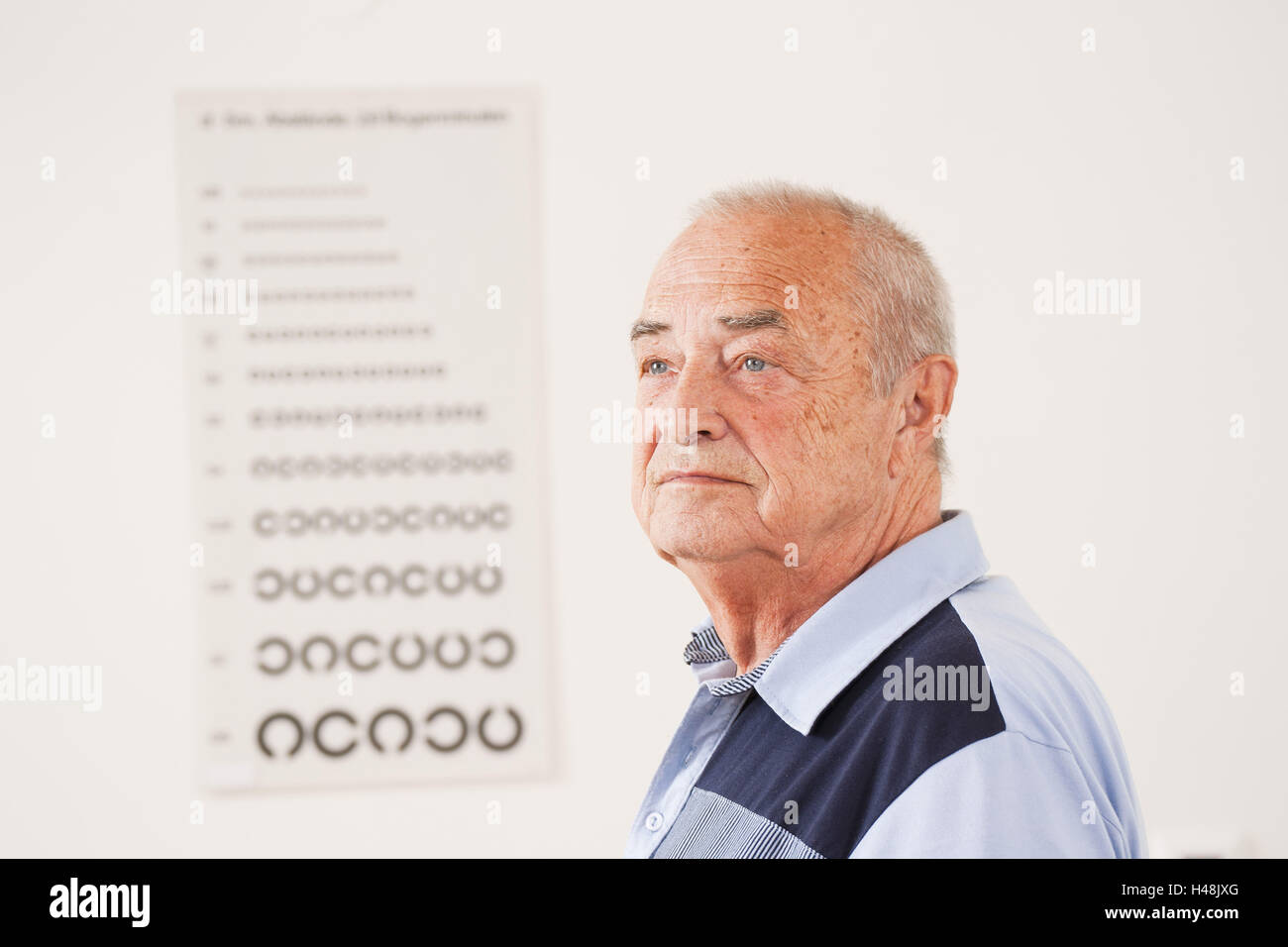 Senior man at visual test Stock Photo - Alamy